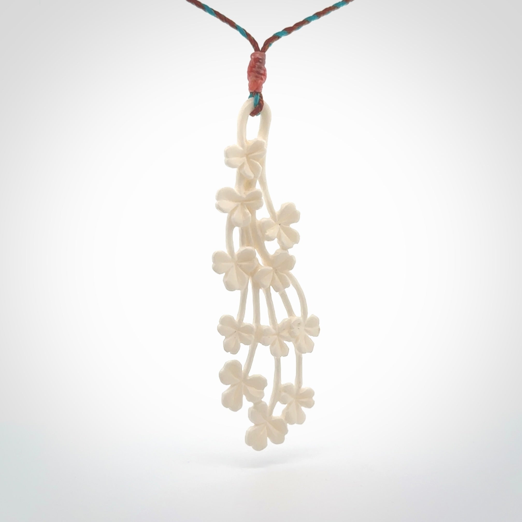 HAND CARVED NATURAL BONE JASMINE FLOWER PENDANT. LARGE BONE PENDANT NZ Pacific