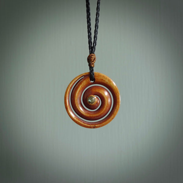 HAND CARVED STAINED BONE KORU PENDANT. HAND MADE STAINED BONE KORU – NZ ...