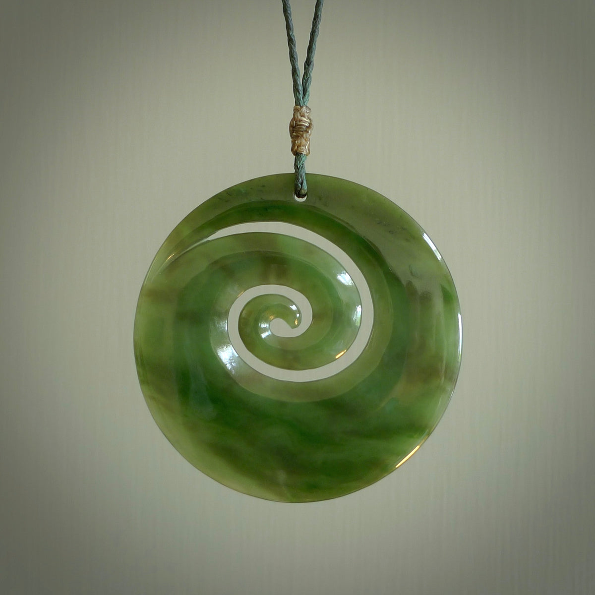 HAND CARVED LARGE BRITISH COLUMBIAN JADE KORU PENDANT. LARGE JADE KORU ...