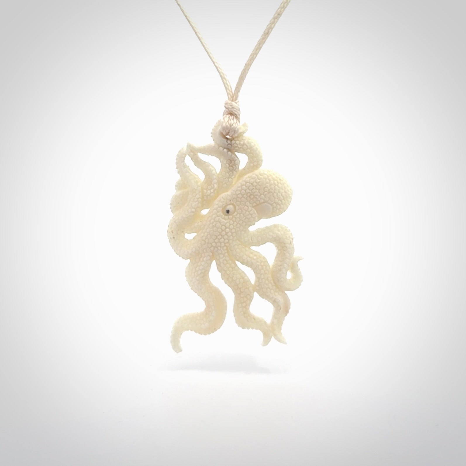HAND CARVED BONE OCTOPUS PENDANT. REAL BONE OCTOPUS NECKLACE. – NZ Pacific
