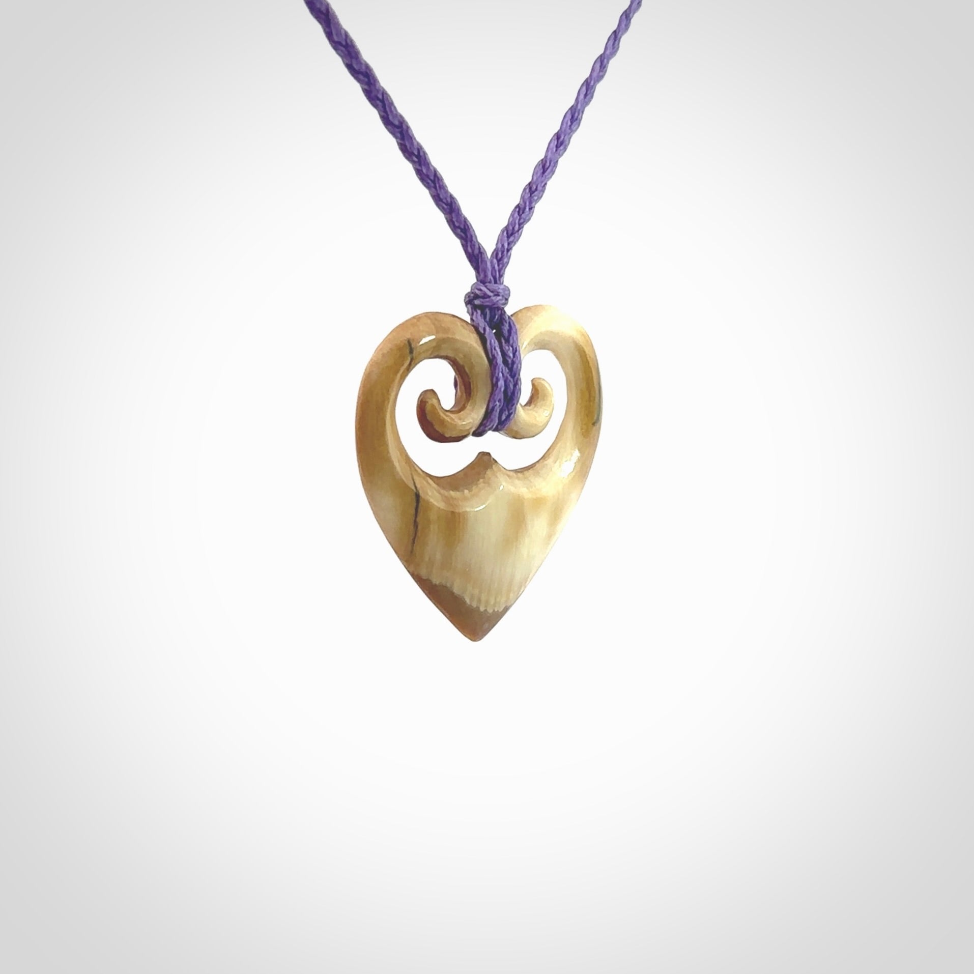 HAND CARVED WOOLLY MAMMOTH TUSK HEART WITH KORU PENDANT – NZ Pacific