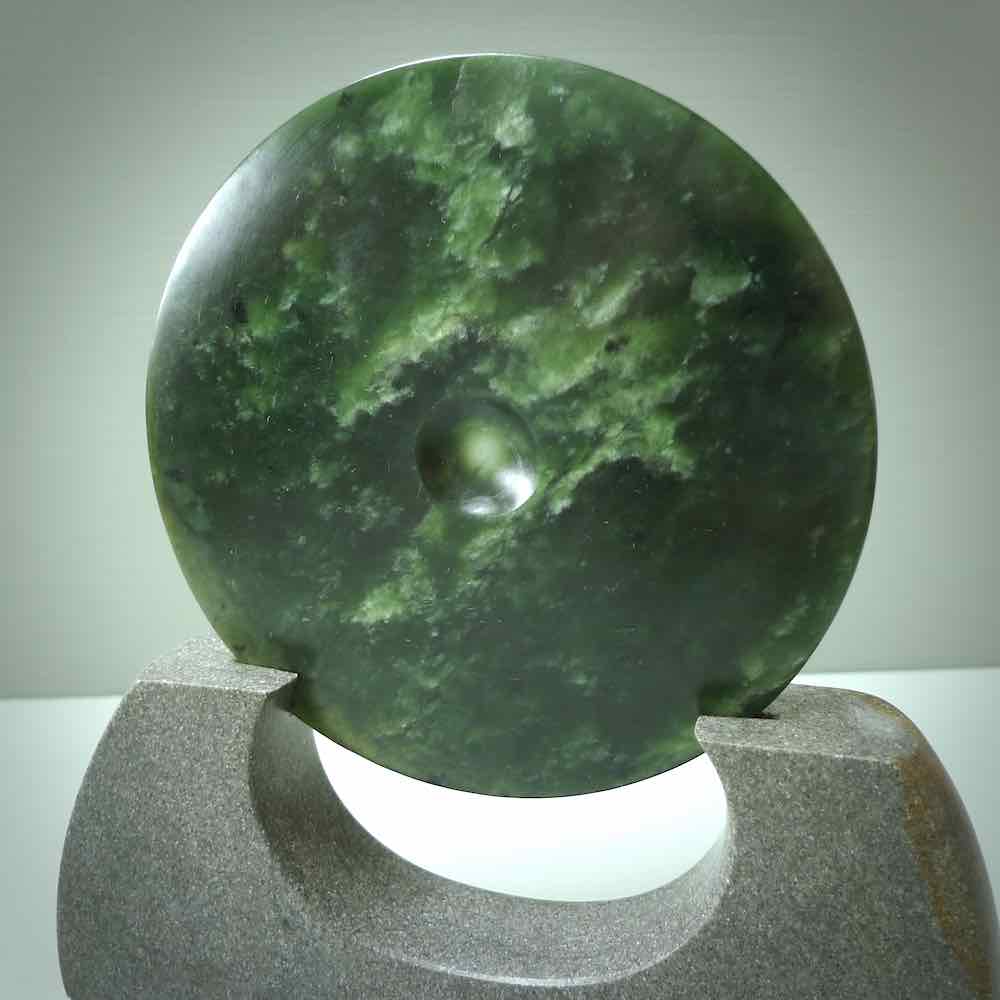 HAND CARVED NEW ZEALAND MARSDEN JADE DISC SCULPTURE WITH STONE STAND ...