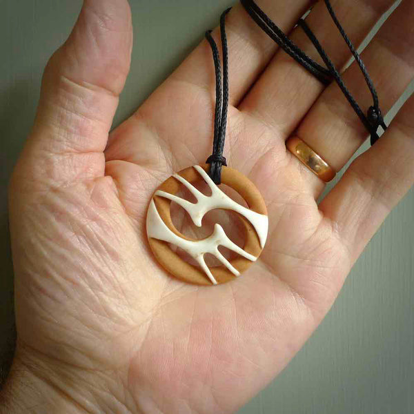 HAND CARVED NATURAL BONE CONTEMPORARY INTRICATE PENDANT. STAINED BONE ...