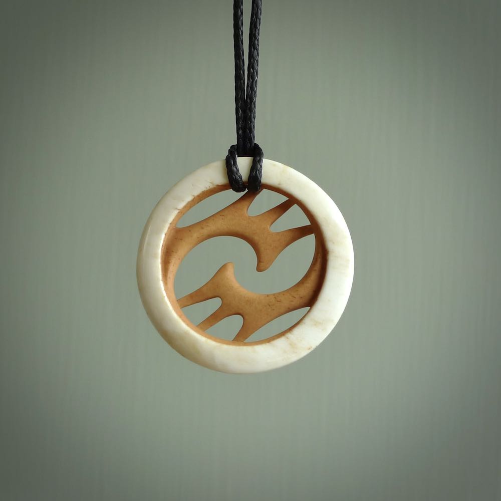 HAND CARVED NATURAL BONE CONTEMPORARY INTRICATE PENDANT. STAINED BONE ...