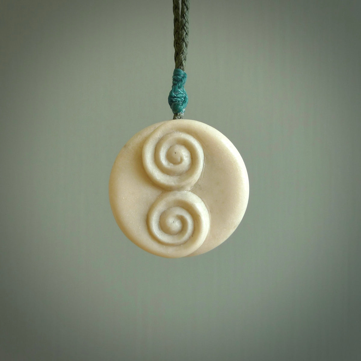 HAND CARVED NATURAL BONE KORU PENDANT - HAND MADE ENGRAVED BONE KORU ...