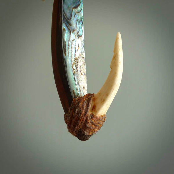 HAND CARVED WHALE BONE PAUA SHELL AND WOOD HOOK WITH DISPLAY STAND HAND CARVED WHALE BONE PAUA SHELL AND WOOD HOOK WITH DISPLAY STAND